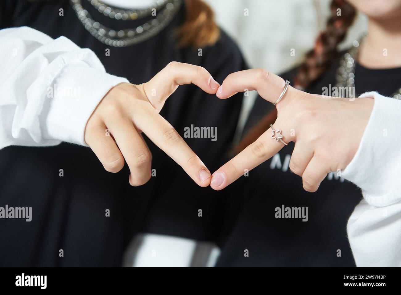 Two girl are friends joined hands and made a heart shape Stock Photo ...