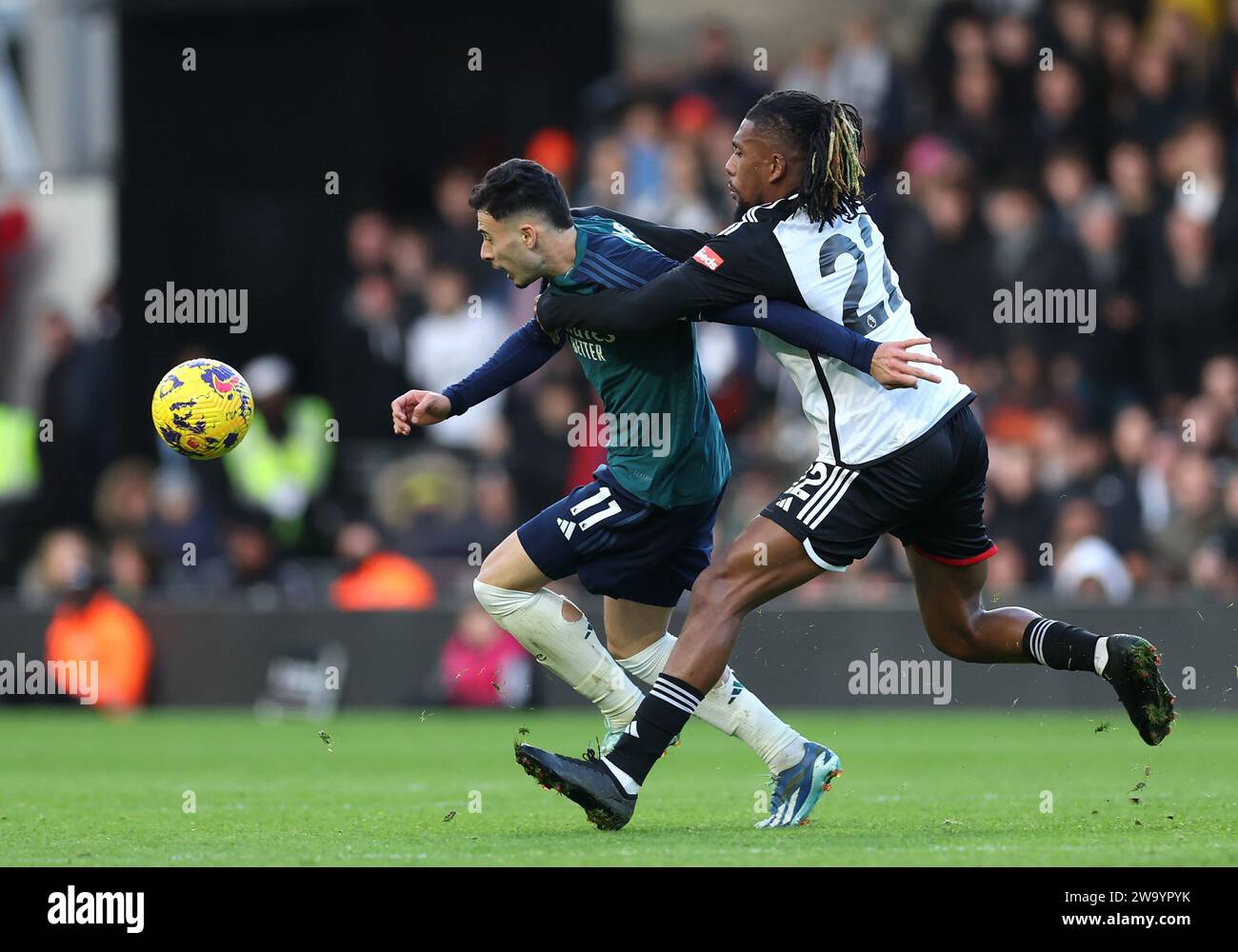 Arsenal's Gabriel Martinelli and Fulham's Alex Iwobi battle for the ...