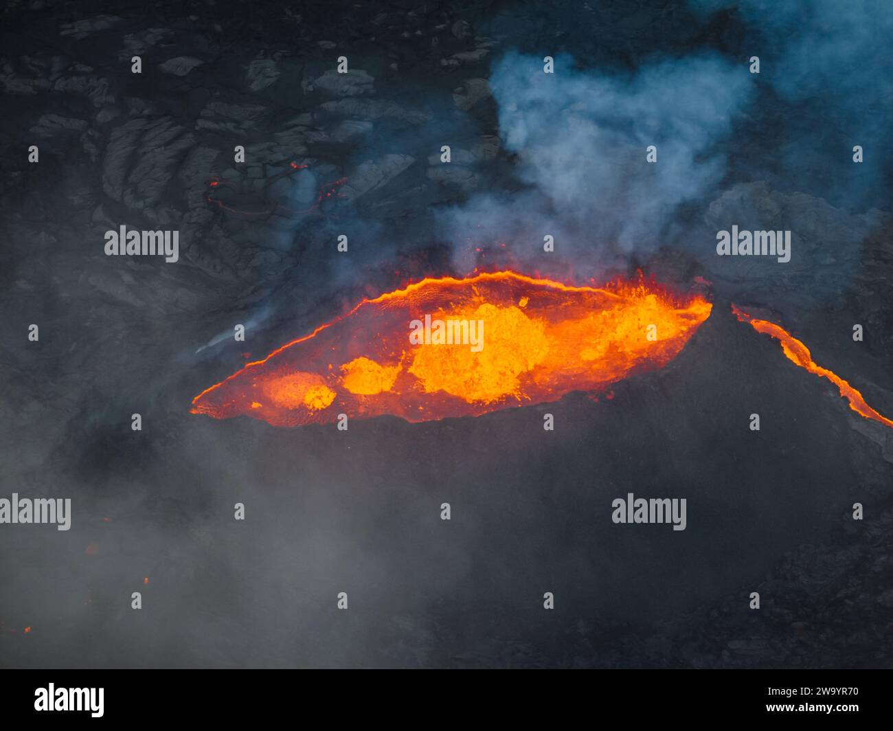 Awesome close up view of boiling red lava lake inside the active ...