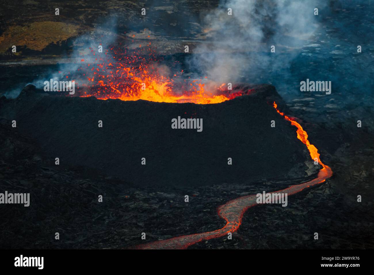 Volcano eruption in Iceland, a fountain of glowing-red lava rising ...