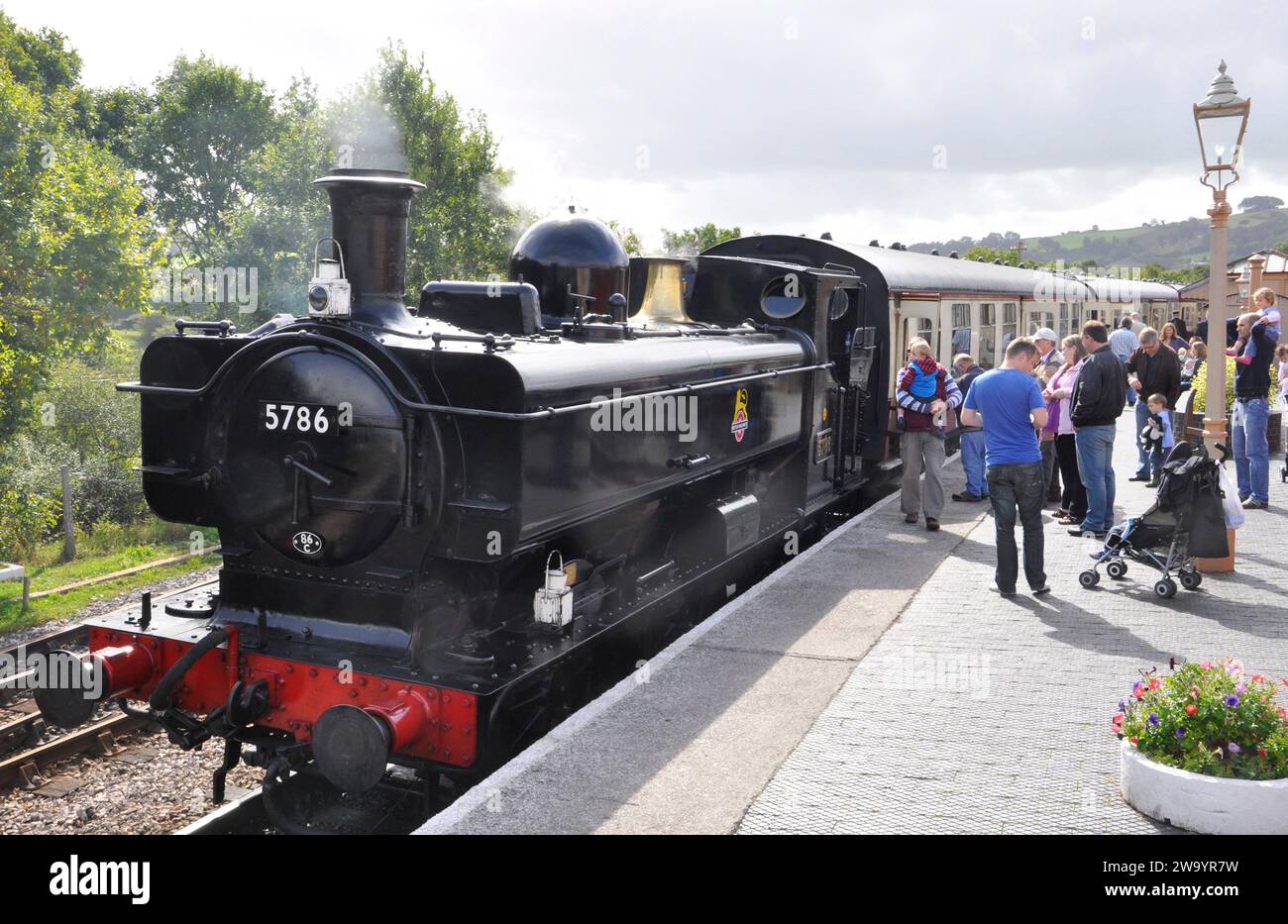 Passengers admiring the steam engine before boarding for a trip on the ...