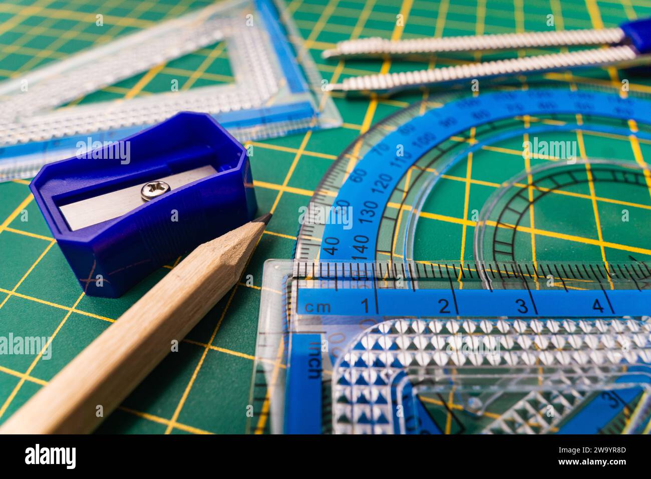 group of various stationery school objects pencil sharpener ruler on a ...