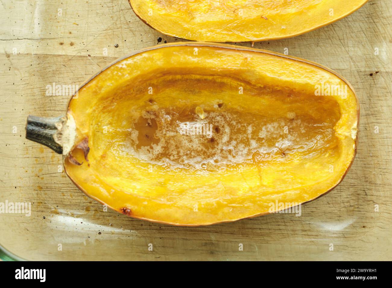 Half a stripetti halved squash open roasted in oven with maple syrup in ...