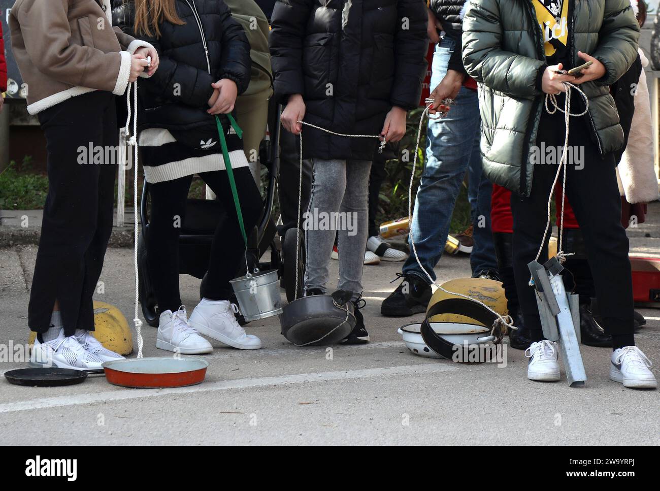 Primosten, Croatia. 31st Dec, 2023. People walk and drag their pots ...