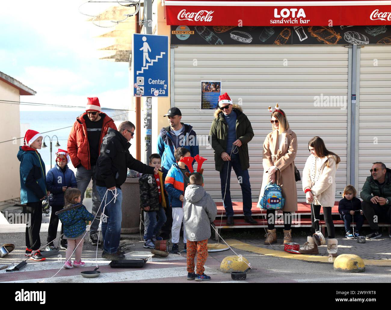 Primosten, Croatia. 31st Dec, 2023. People walk and drag their pots ...