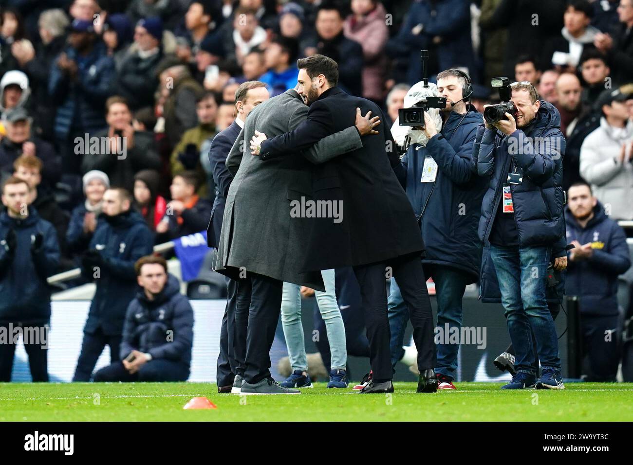 Former Tottenham Hotspur goalkeeper Hugo Lloris hugs Ledley King at a ...