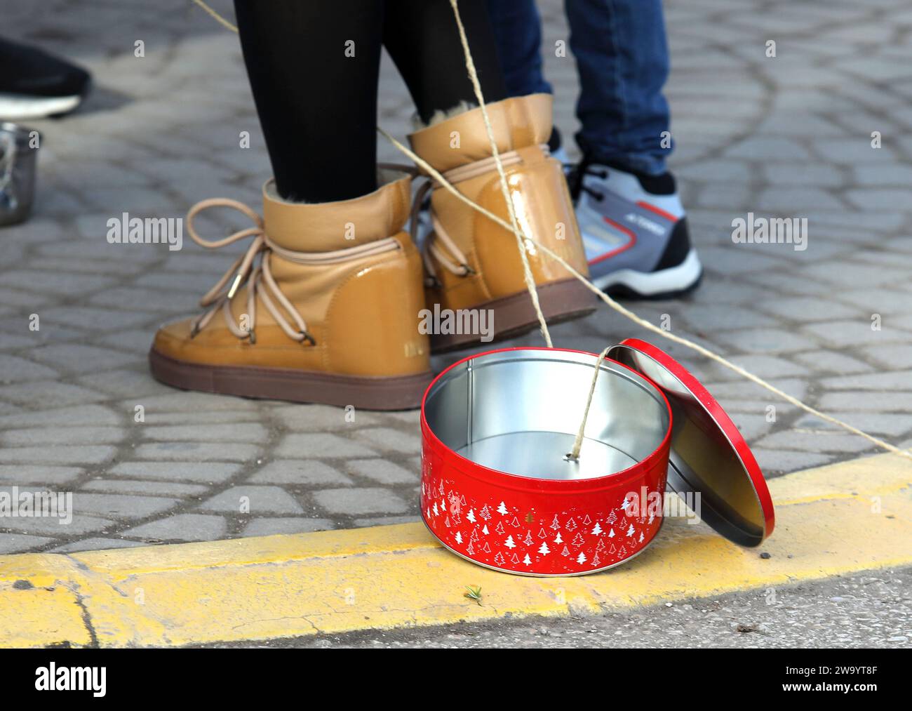 Primosten, Croatia. 31st Dec, 2023. People walk and drag their pots ...