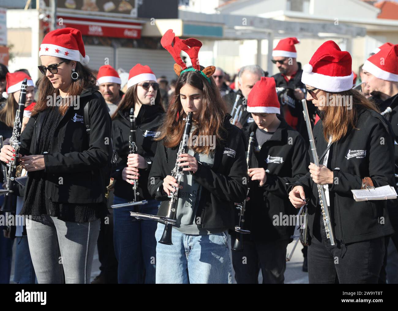 Primosten, Croatia. 31st Dec, 2023. People walk and drag their pots ...