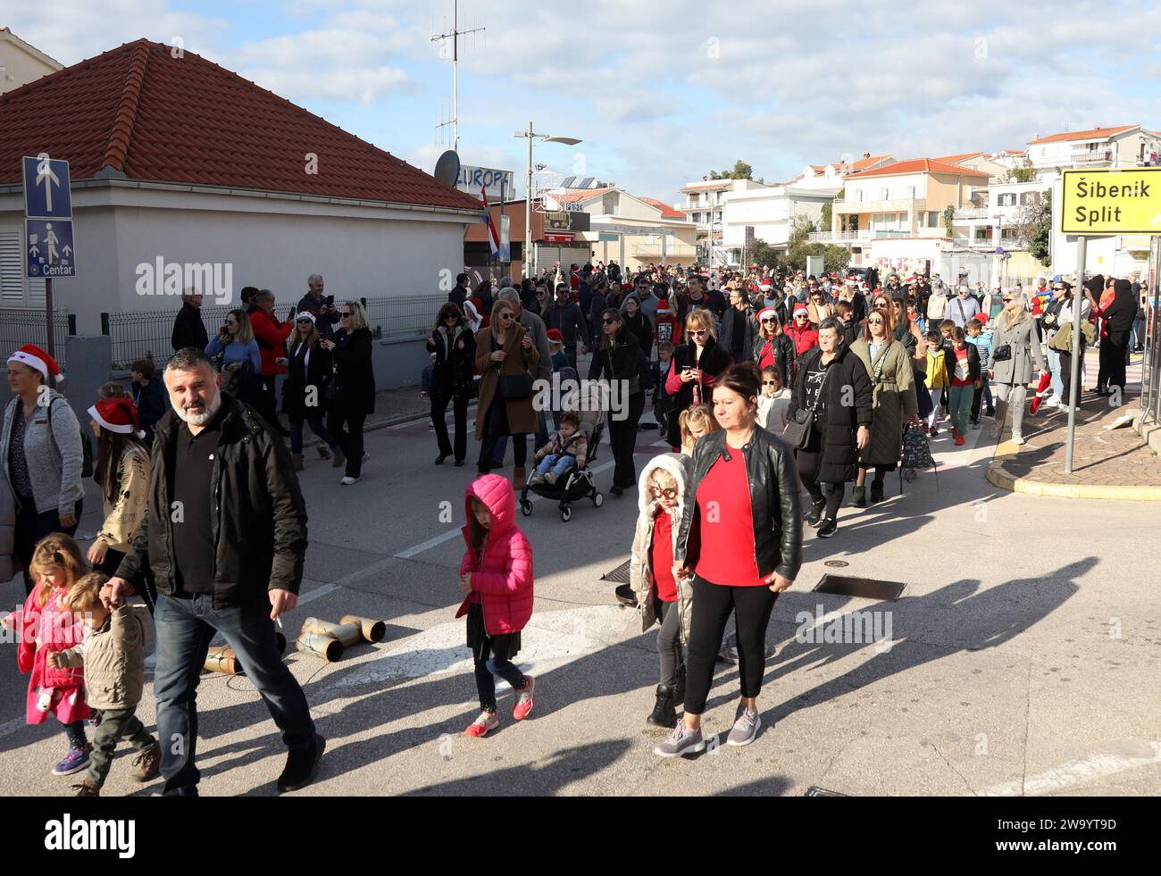 Primosten, Croatia. 31st Dec, 2023. People walk and drag their pots ...