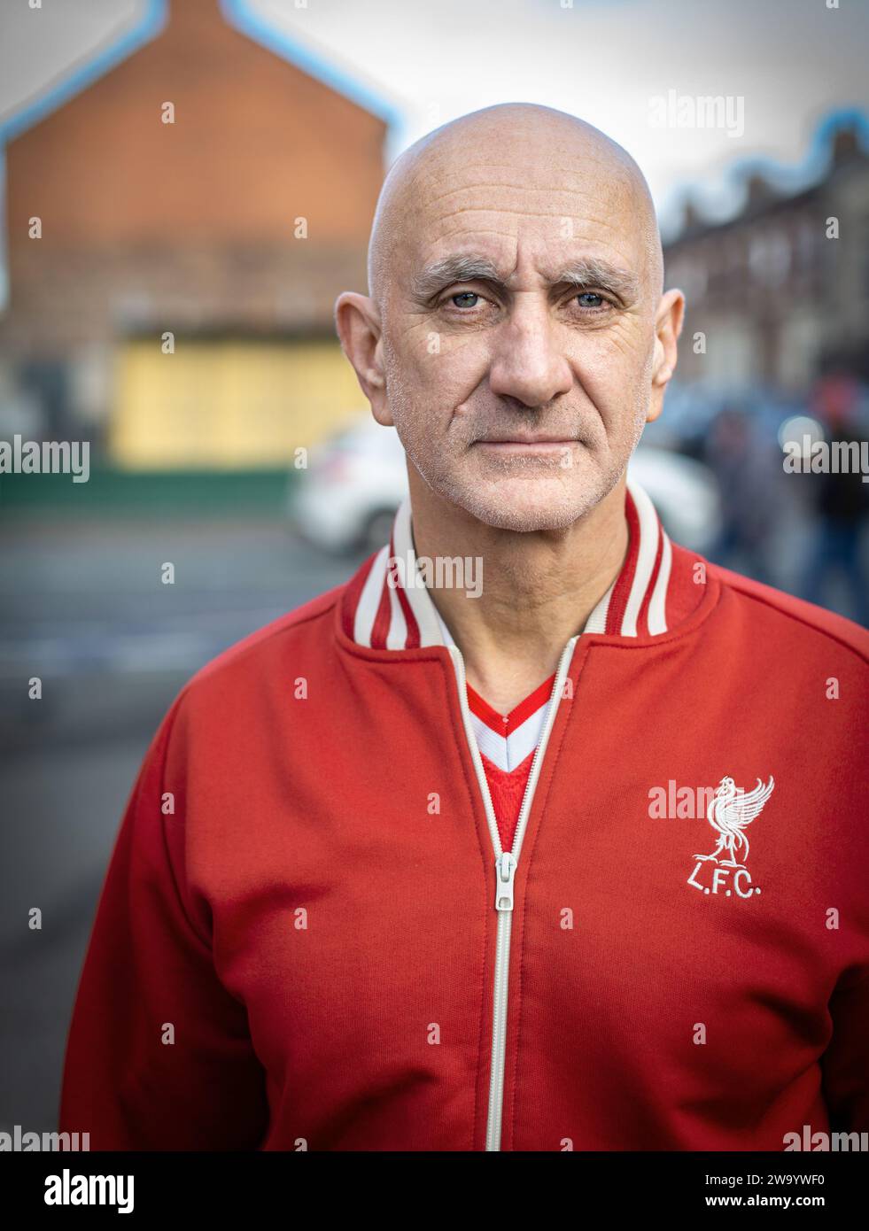 Liverpool FC supporter wearing a retro Shankly track jaket Stock Photo ...