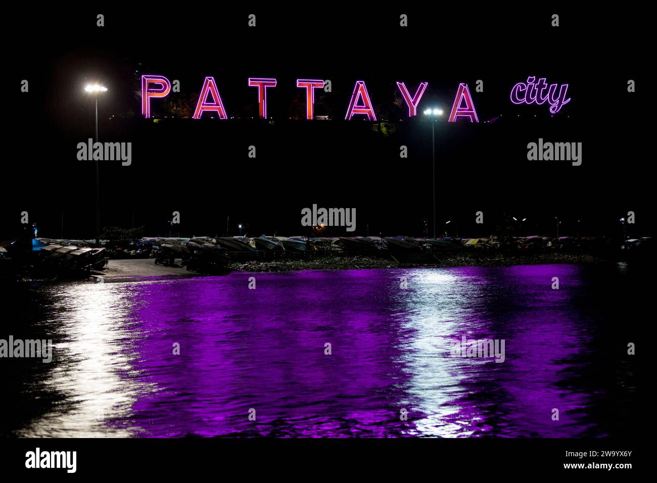 Neon sign of “Pattaya City” at the bottom of Pattaya hill, by the sea ...