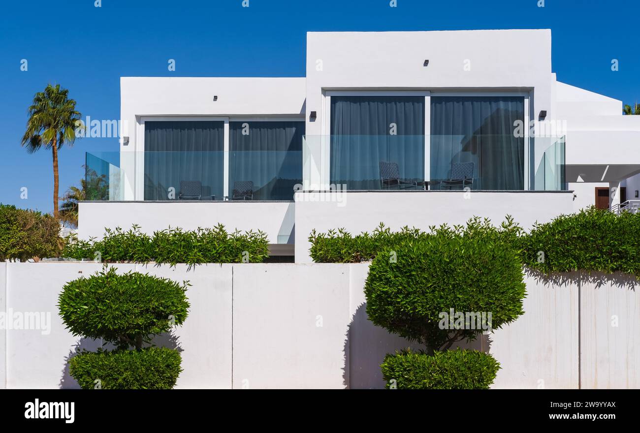 White villas in Middle East, on a background of blue sky. Holidays in ...