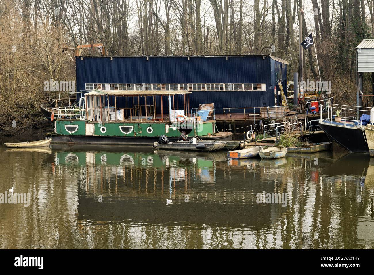 Working boatyards at Isleworth Ait on the River Thames, west London ...