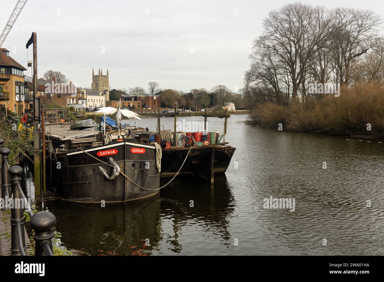 Boats moored at Isleworth Ait with All Saints Church tower behind, Old ...