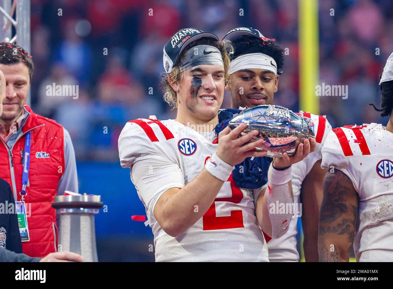 December 30, 2023: Jaxson Dart of Ole Miss hoists the Chick-fil-A Peach ...