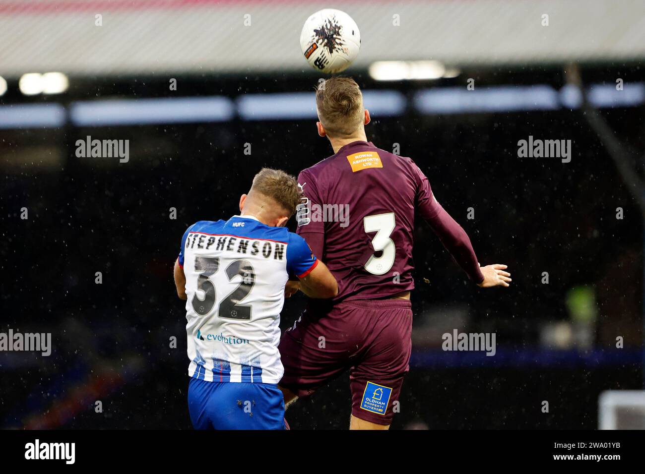 Mark Kitching of Oldham Athletic Association Football Club is tussling ...