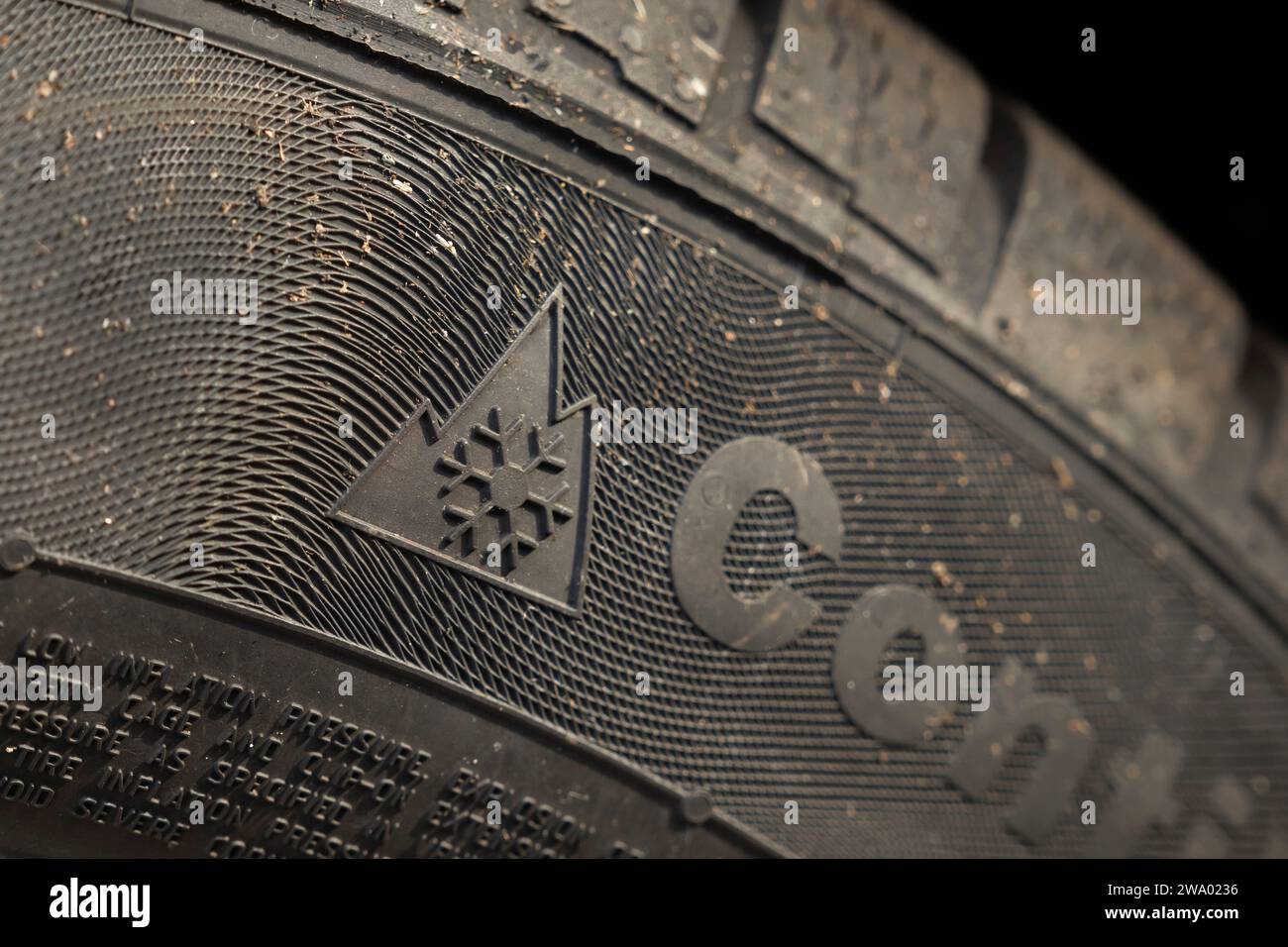Alpine symbol on a winter tyre. The three-pointed mountain pictogram ...
