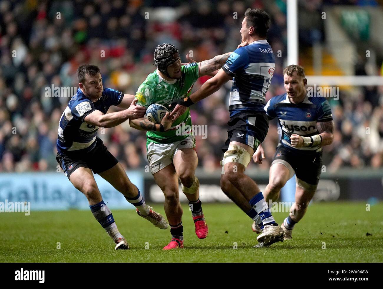 Leicester Tigers' Finn Theobald-Thomas is tackled by Bath's Ewan ...