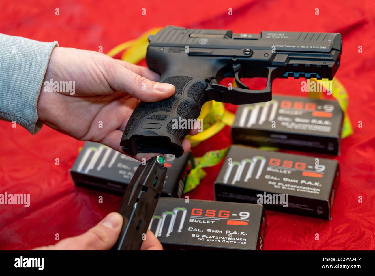 Kammlach, Bavaria, Germany - December 31, 2023: Man holding a PTB alarm ...