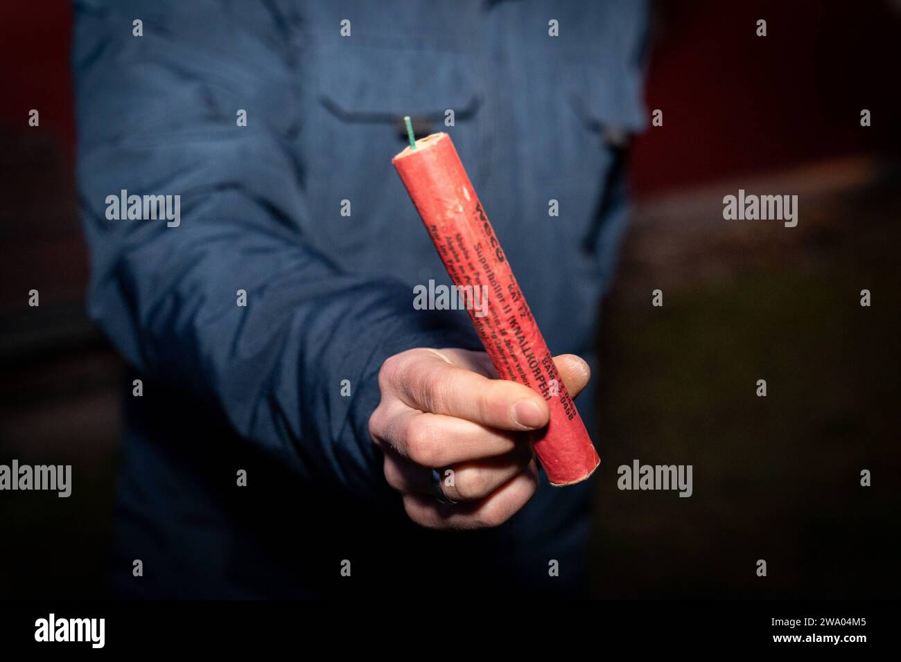 Kammlach, Bavaria, Germany - December 31, 2023: Man holding a large ...