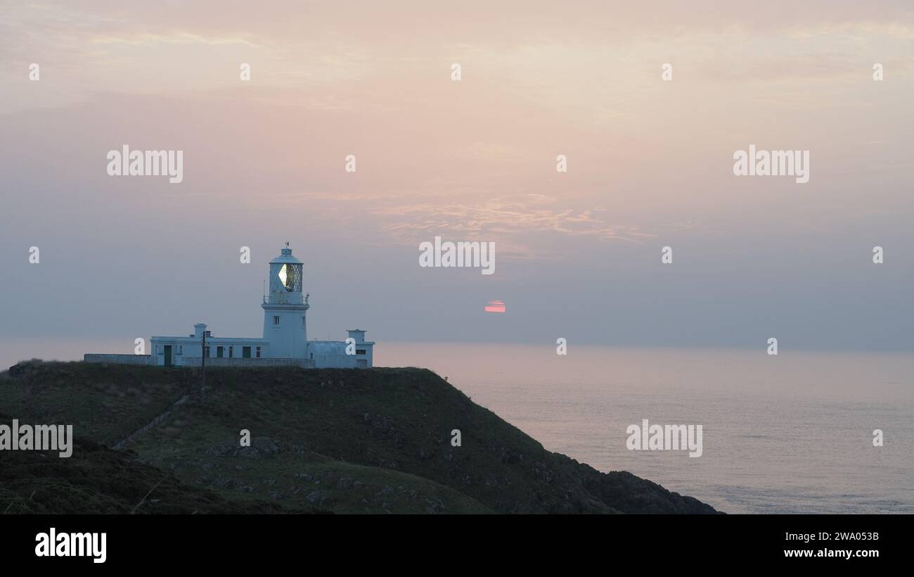 Sunset at Strumble Head lighthouse Stock Photo - Alamy