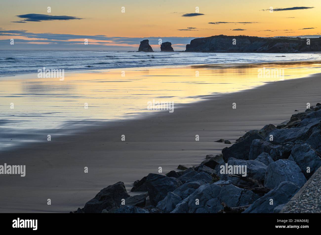Golden sunrise in Hendaye, in the foreground the Hendaye beach, with ...