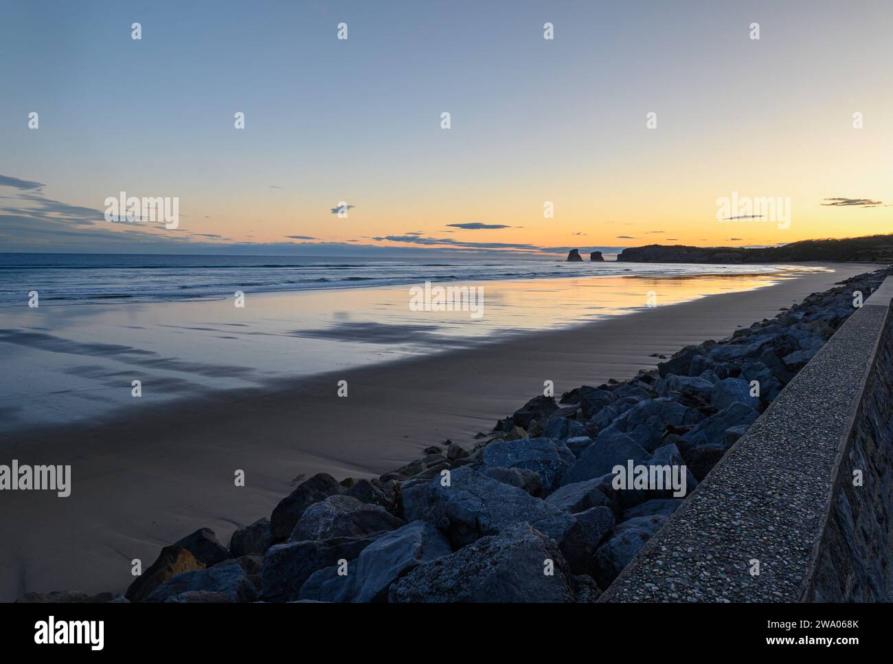 Golden sunrise in Hendaye, in the foreground the Hendaye beach, with ...