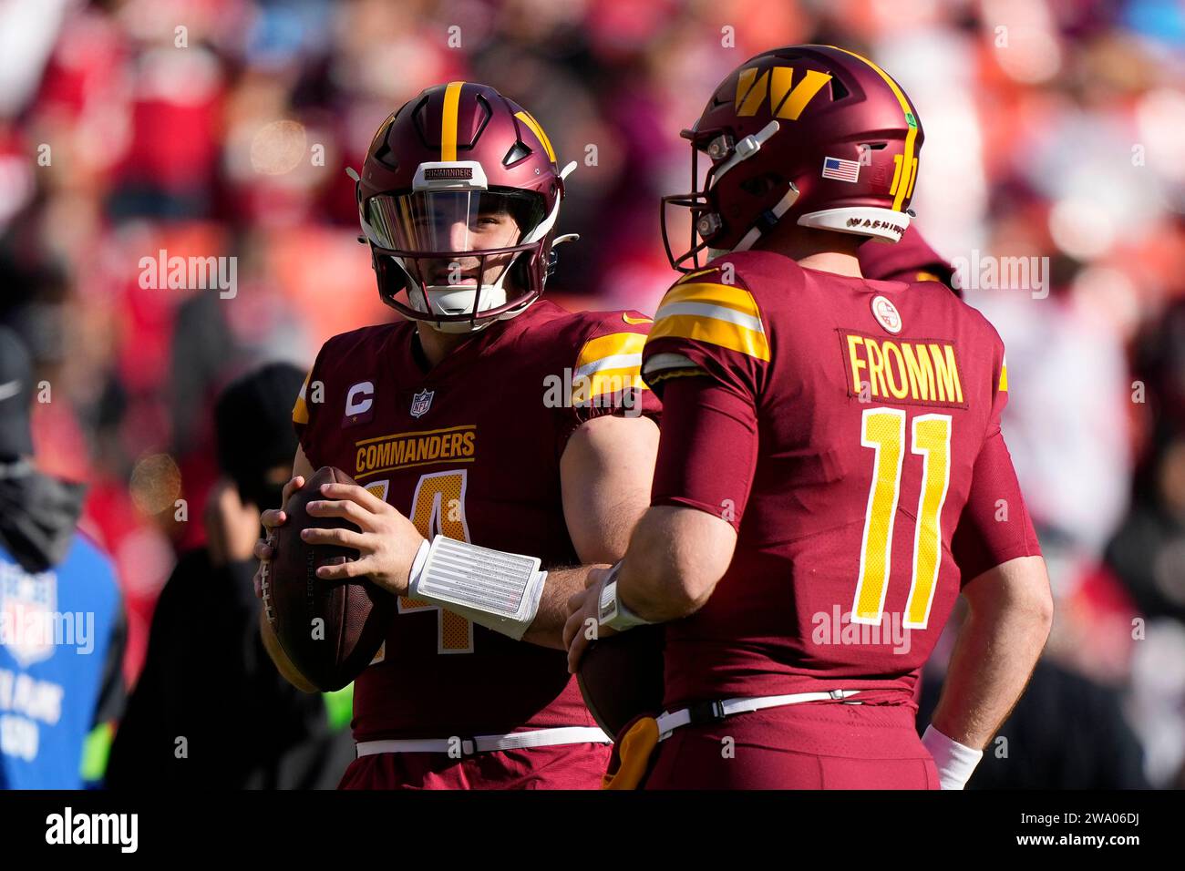 Washington Commanders quarterbacks Sam Howell (14) and Jake Fromm (11 ...