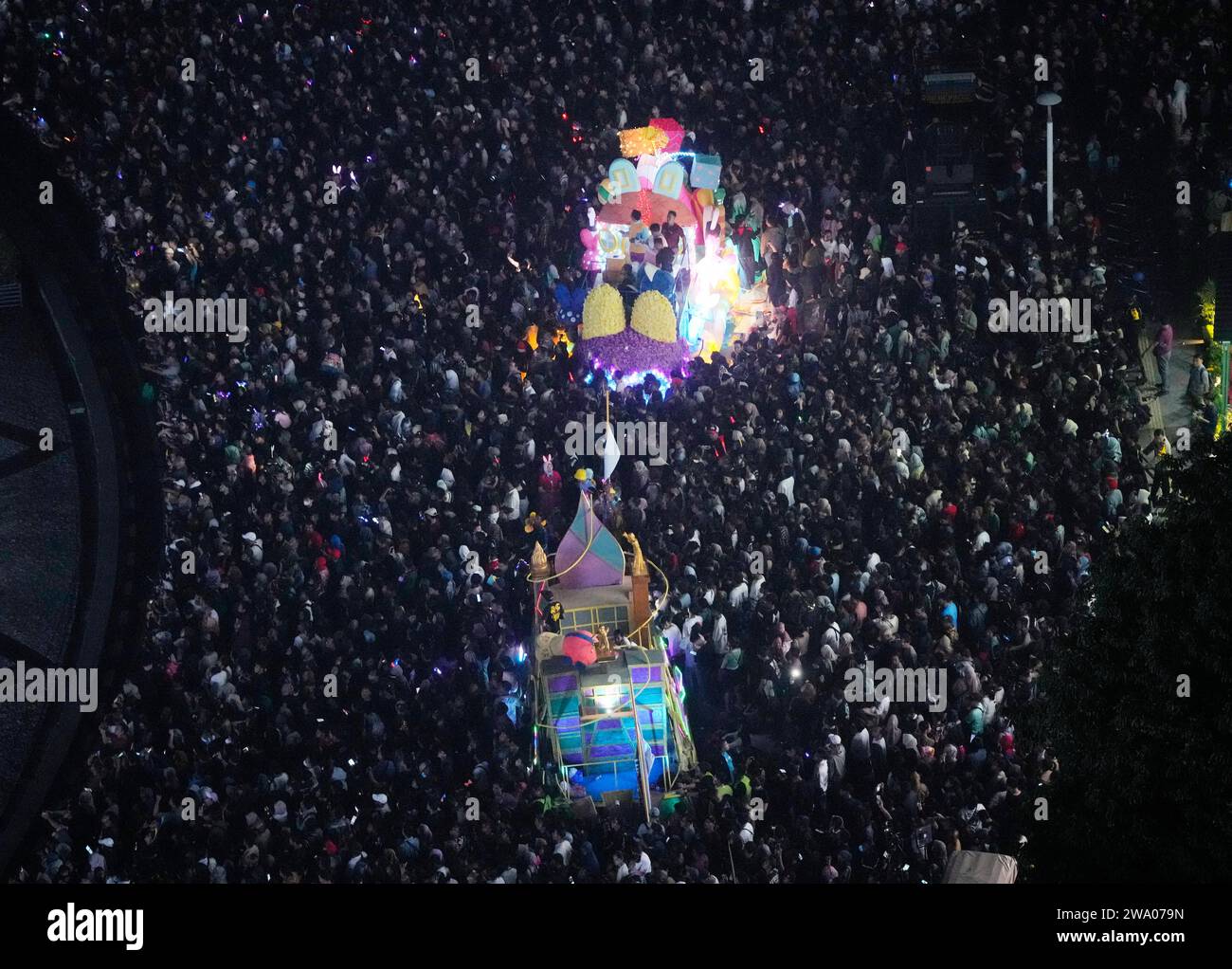People gather in the main business district on New Year's Eve in ...
