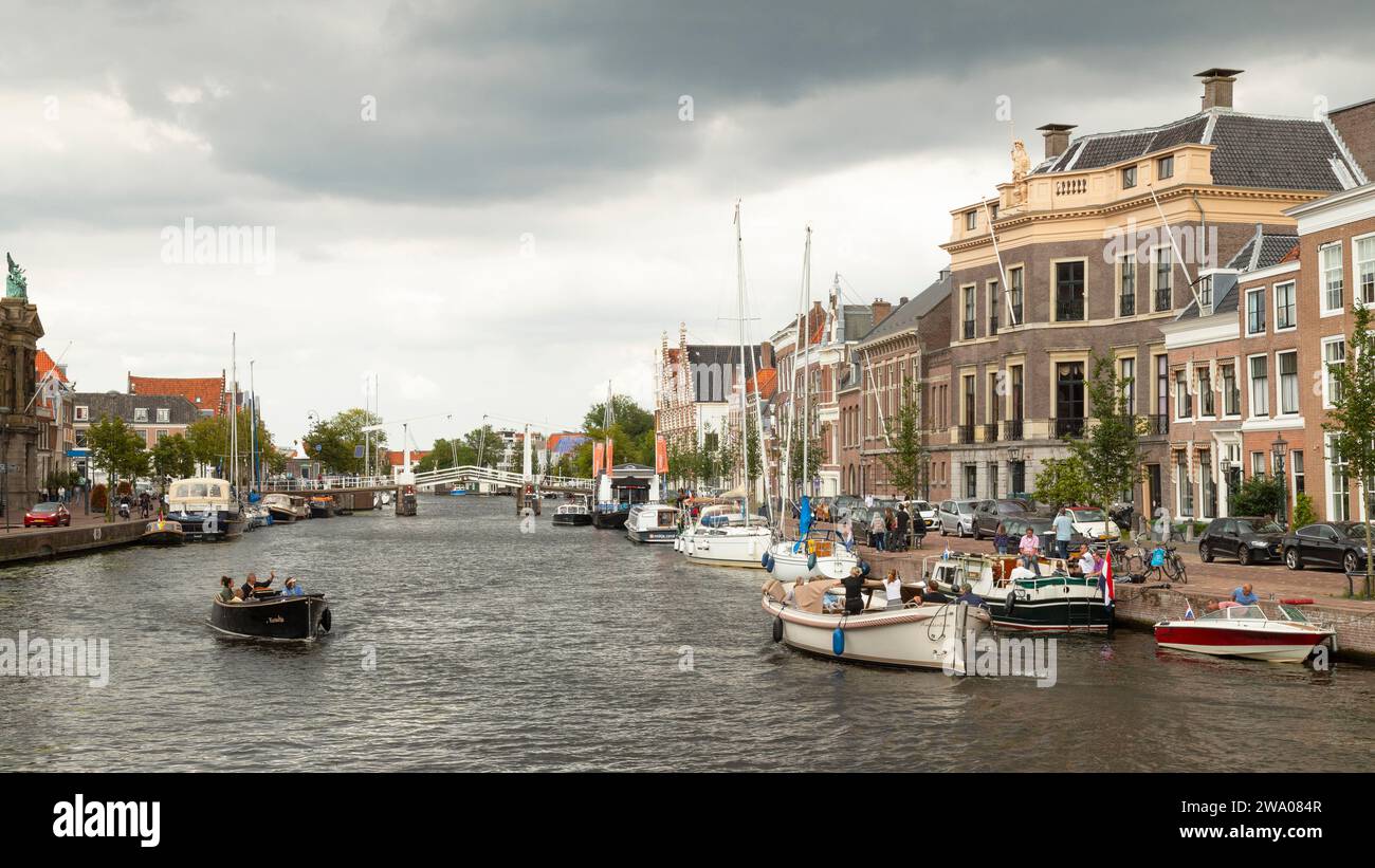 Sailing on the river Spaarne in the center of the medieval city of ...