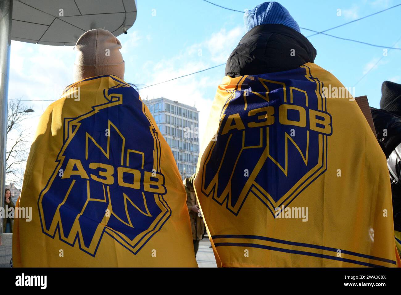 Women wrapped in the flags of the Azov regiment, during an action in ...