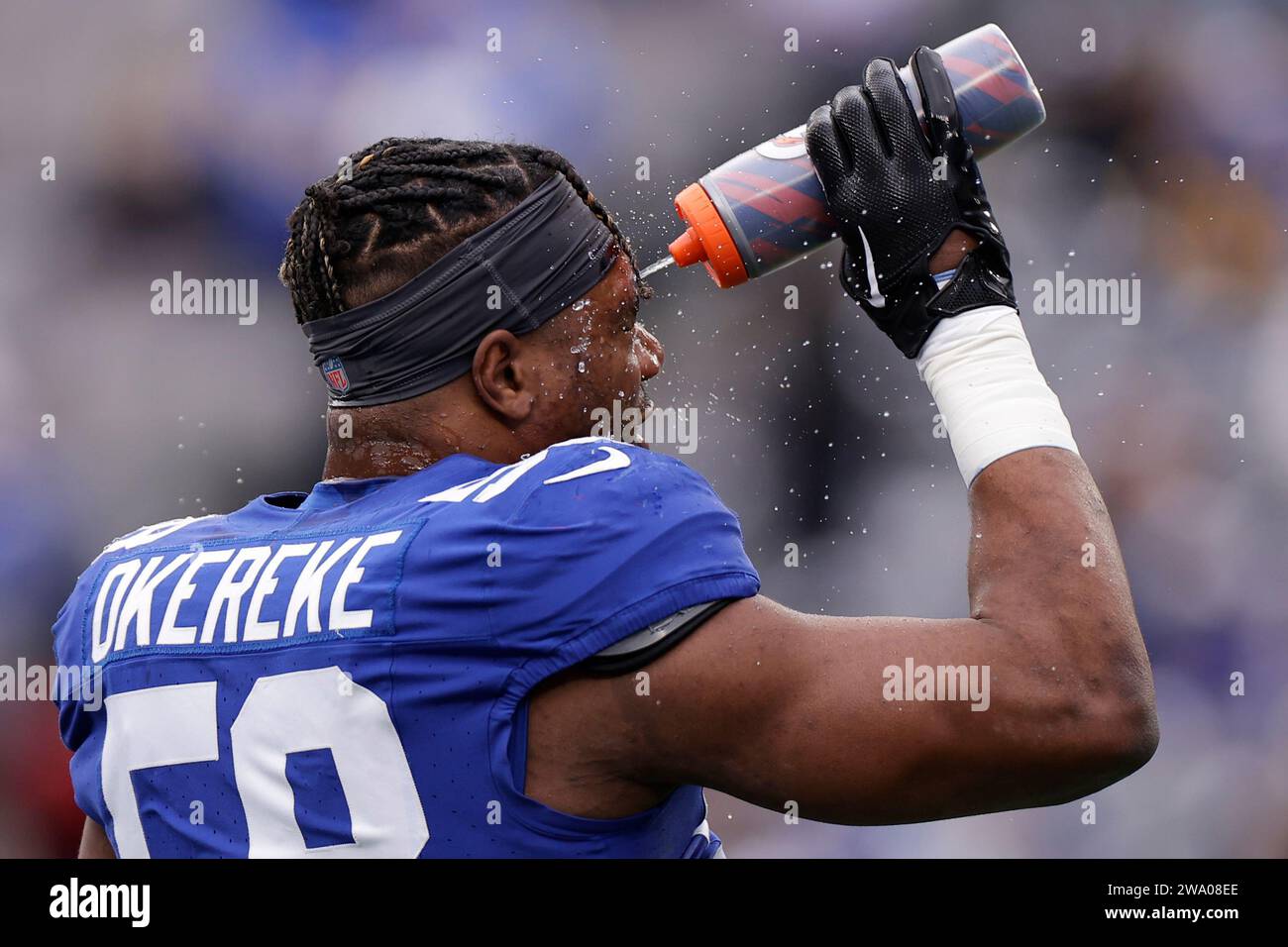New York Giants linebacker Bobby Okereke (58) douses himself with water ...