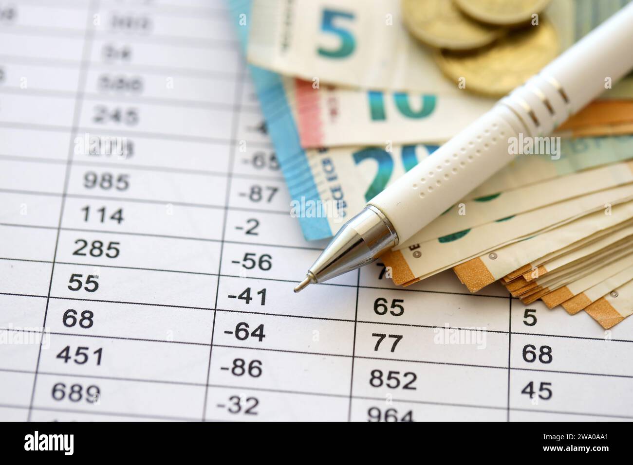 Business concept with many euro money bills and pen on schedules with ...