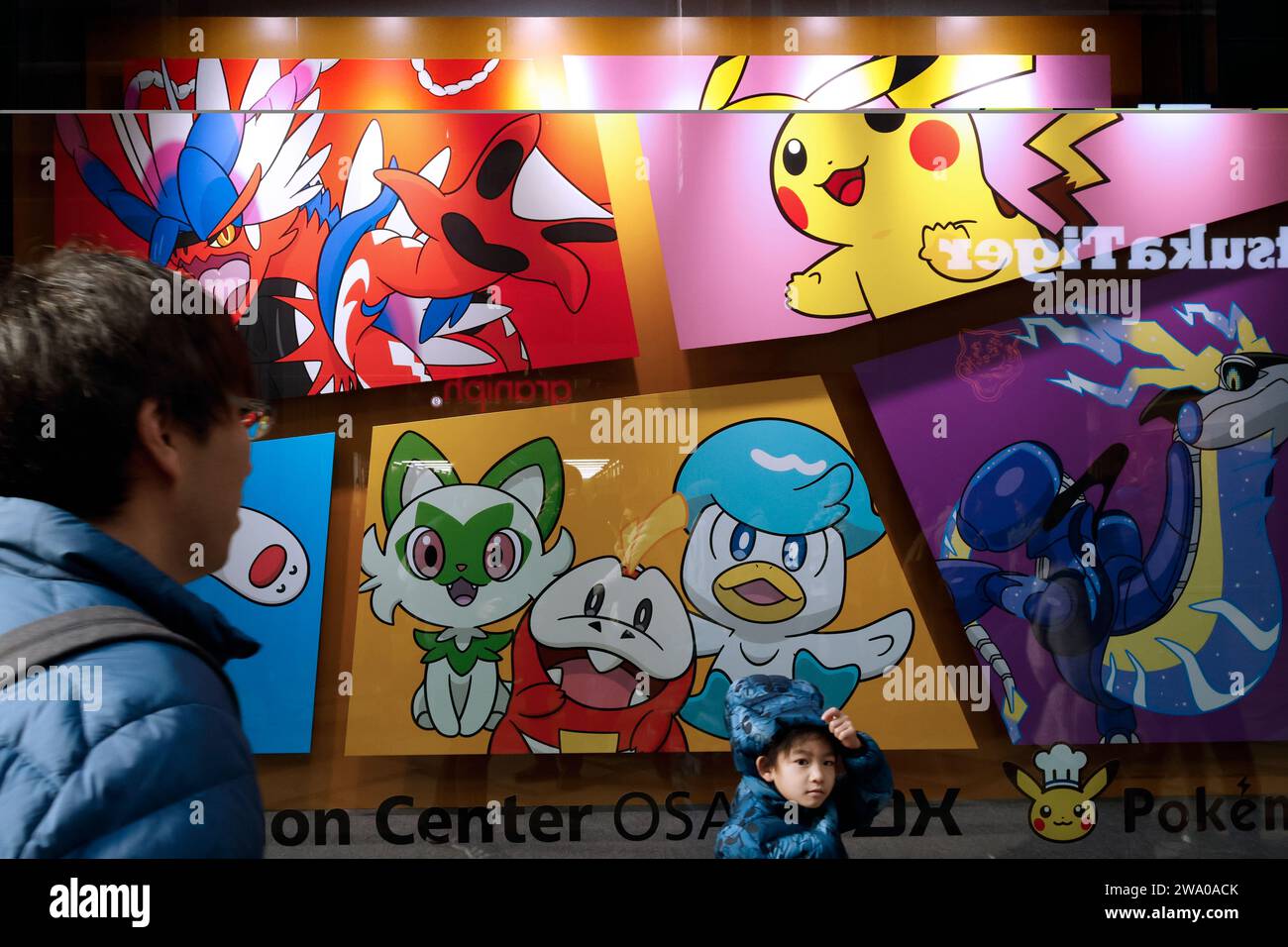 Osaka, Japan. 29th Dec, 2023. Customers walk past the Pokemon Store ...