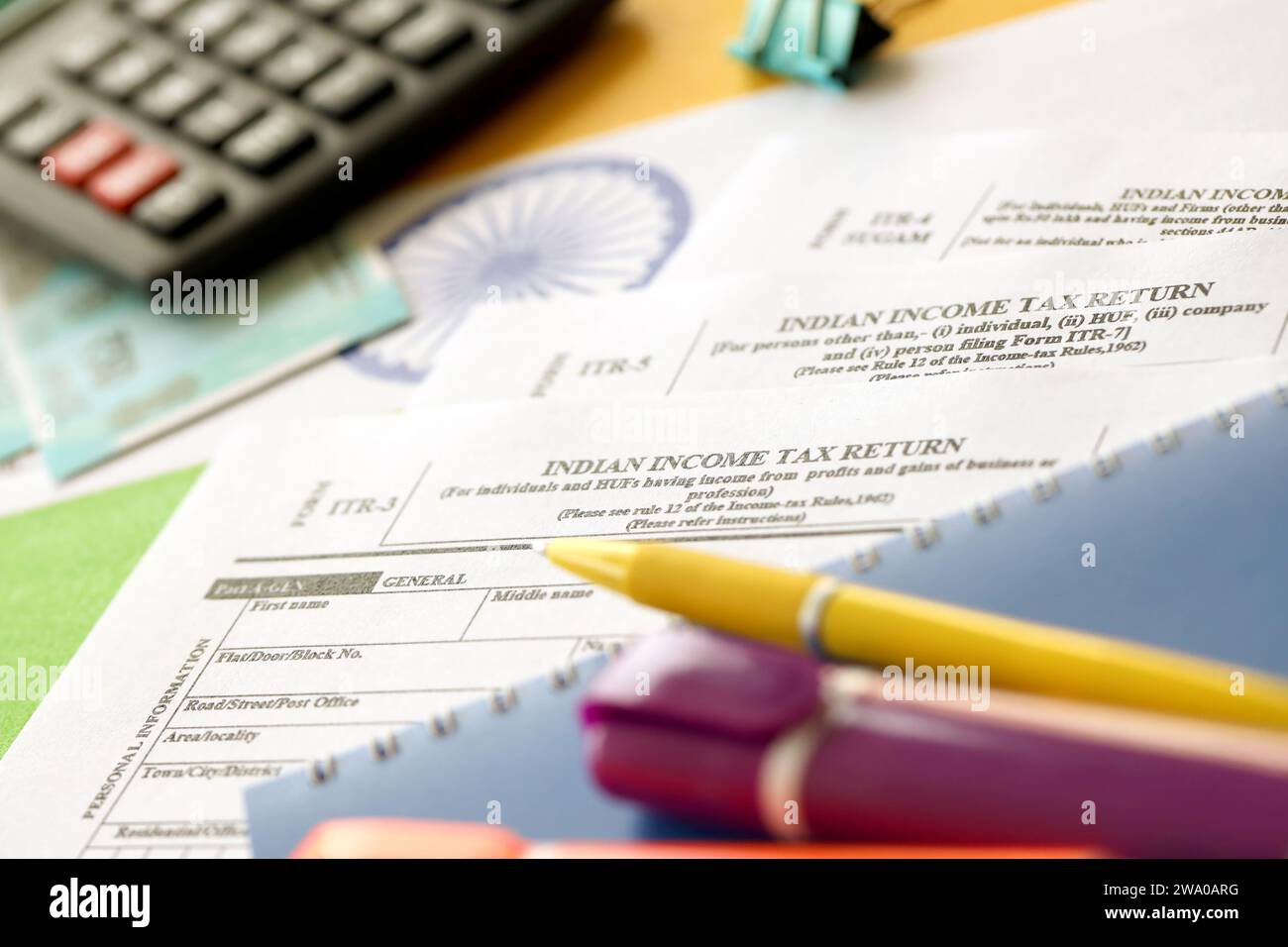 Indian income tax return blank form with pen and indian rupees bills on ...