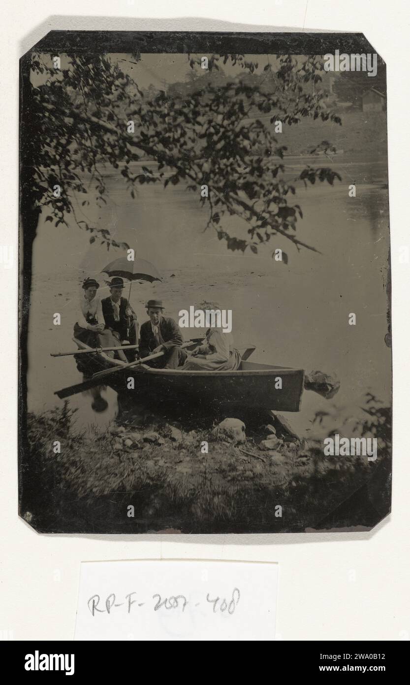 Two men and two women in a rowing boat on a lake, c. 1880 - 1910 ...