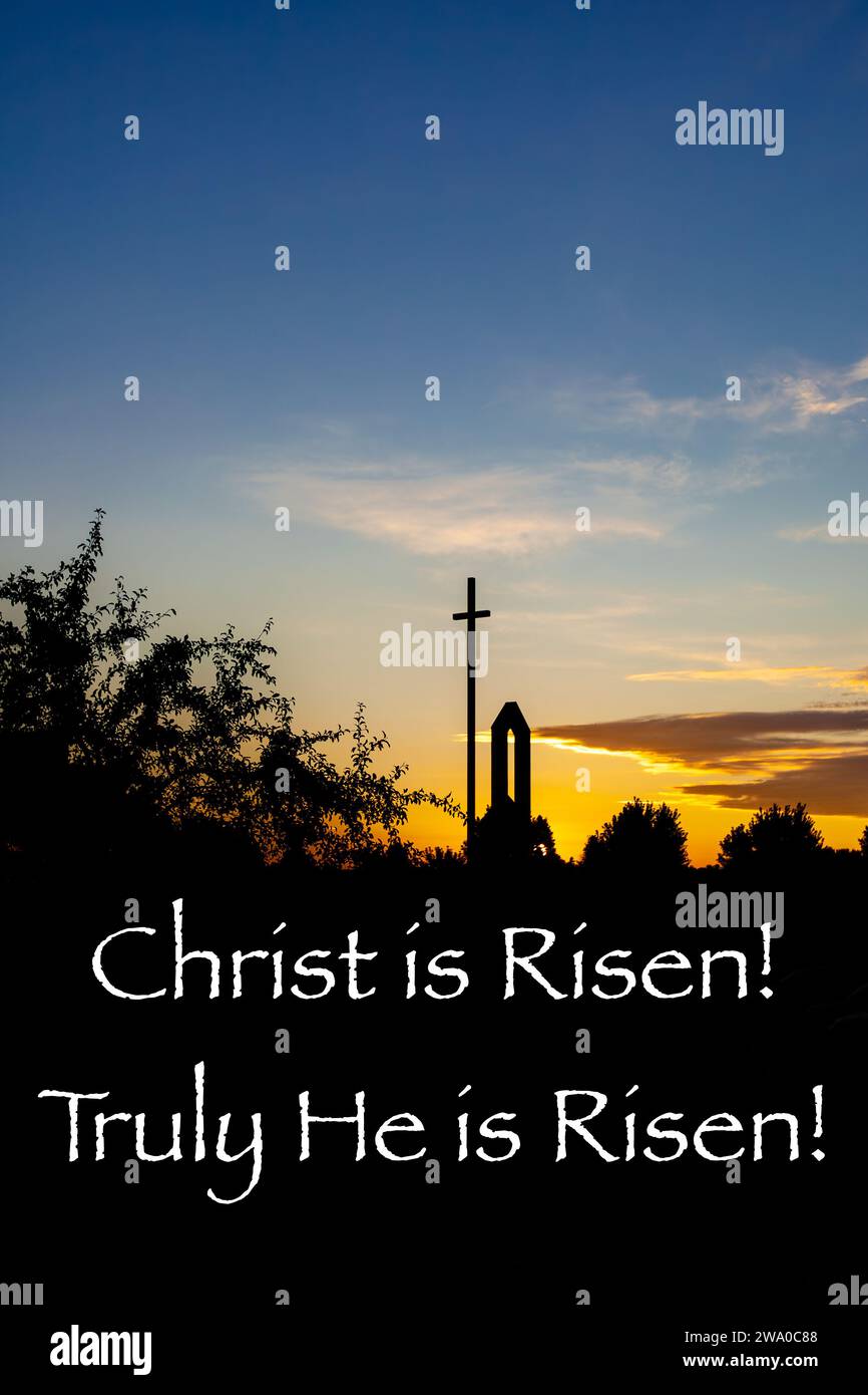 Christian Cross at sunrise with clouds and blue sky, vertical Stock ...