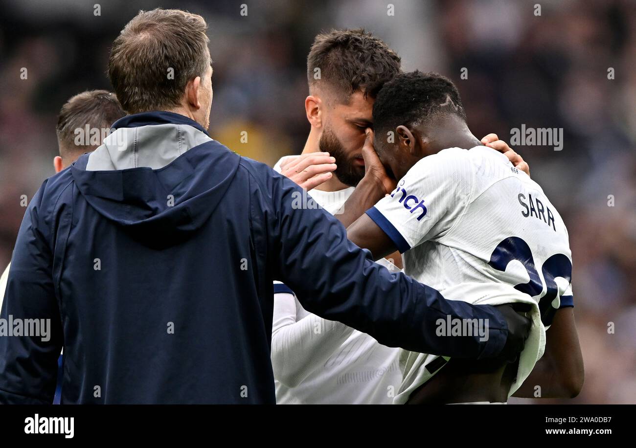London, UK. 31st Dec, 2023. Pape Matar Sarr (Tottenham) is consoled by ...