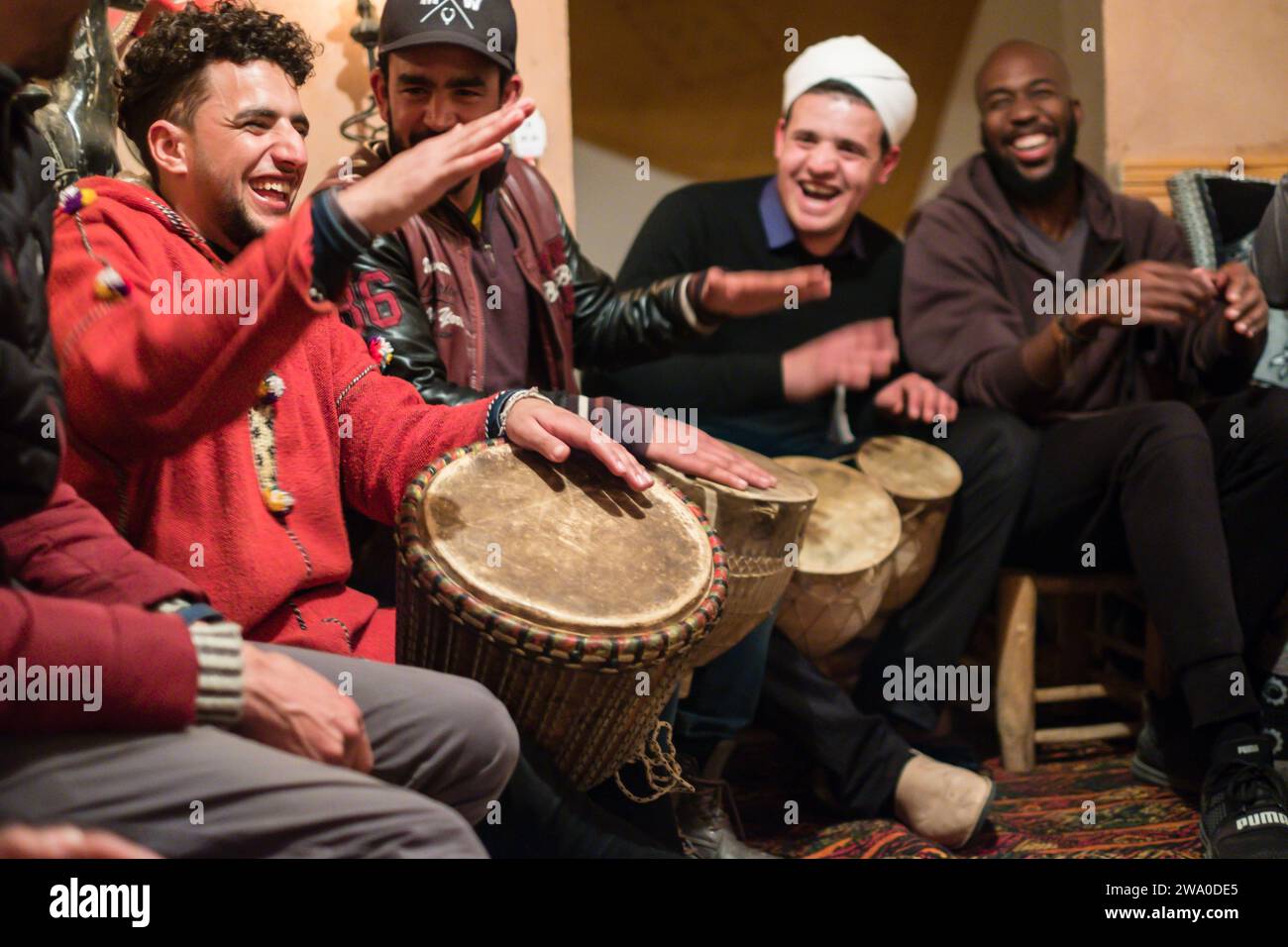 North African men play Moroccan hand drums to the delight of onlooking ...