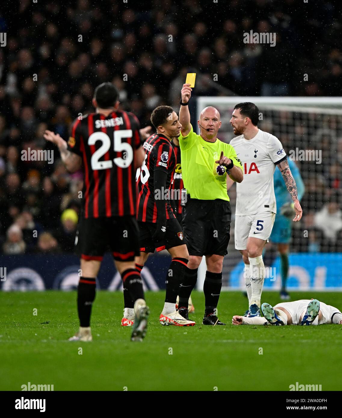 London, UK. 31st Dec, 2023. Simon Hooper (Referee) shows the yellow ...