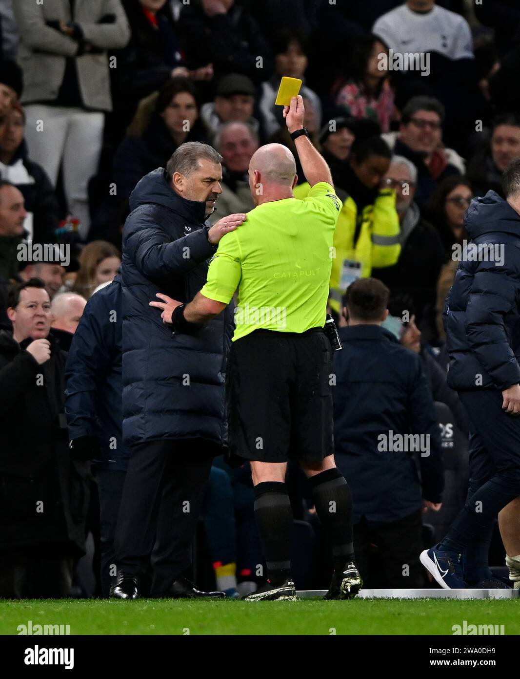 London, UK. 31st Dec, 2023. Simon Hooper (Referee) shows the yellow ...