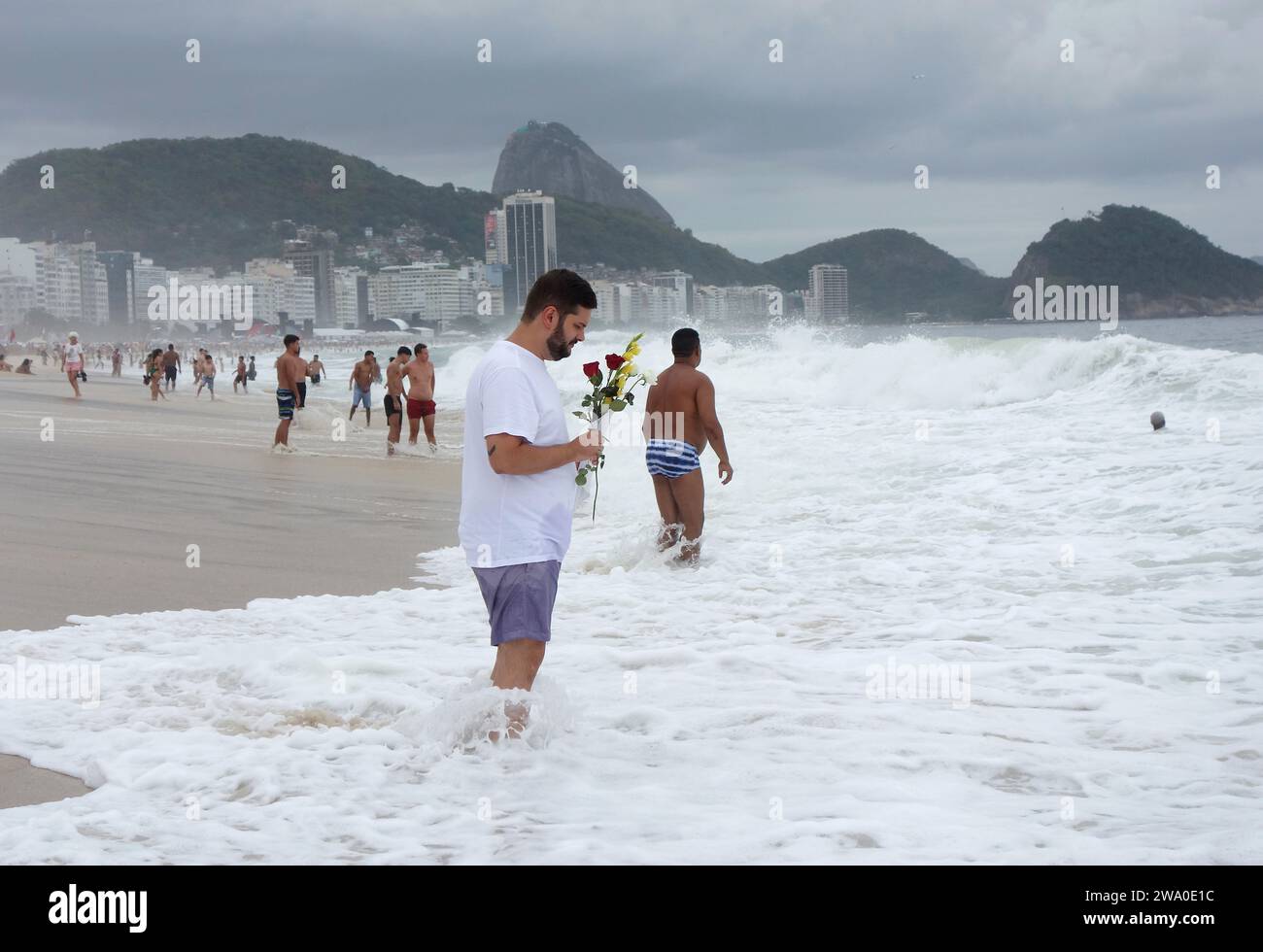Rio de Janeiro, Rio de Janeiro, Brazil. 31st Dec, 2023. A man says a ...
