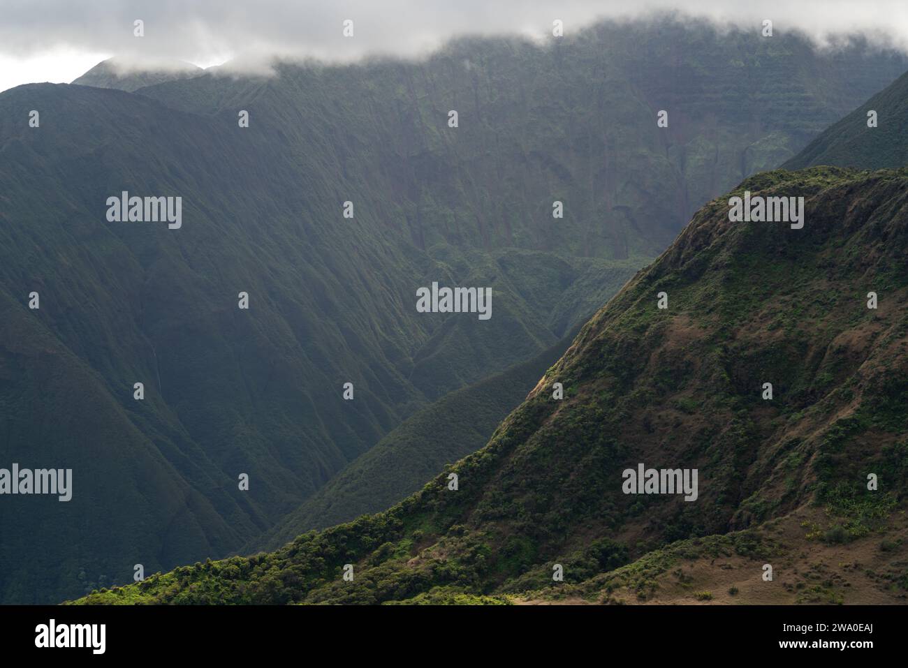 Light plays across the folds of the West Maui Mountains, viewed from ...