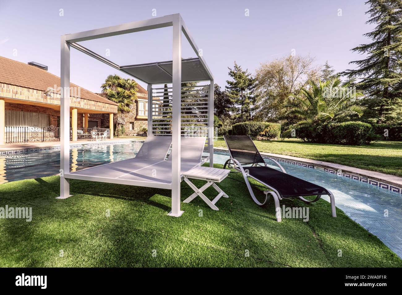 Outdoor swimming pool of a luxury single-family residential home with ...