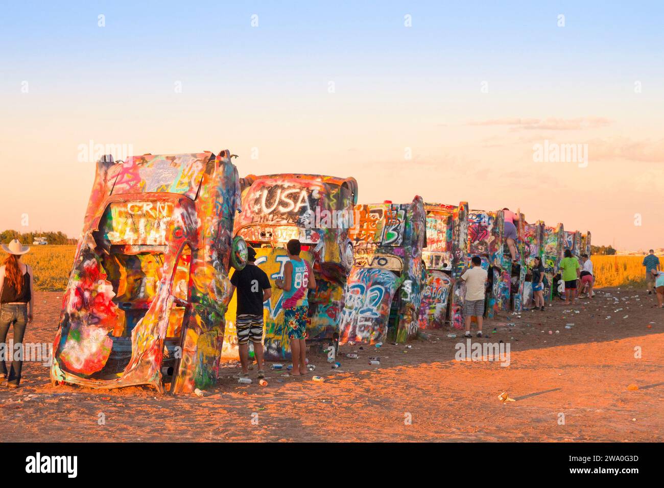 teens spraying paint sunset over famous line spray painted american ...