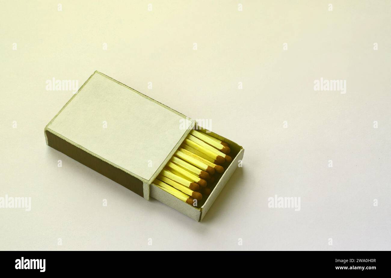 Open cardboard matchbox filled with matches on a white background. Flat ...