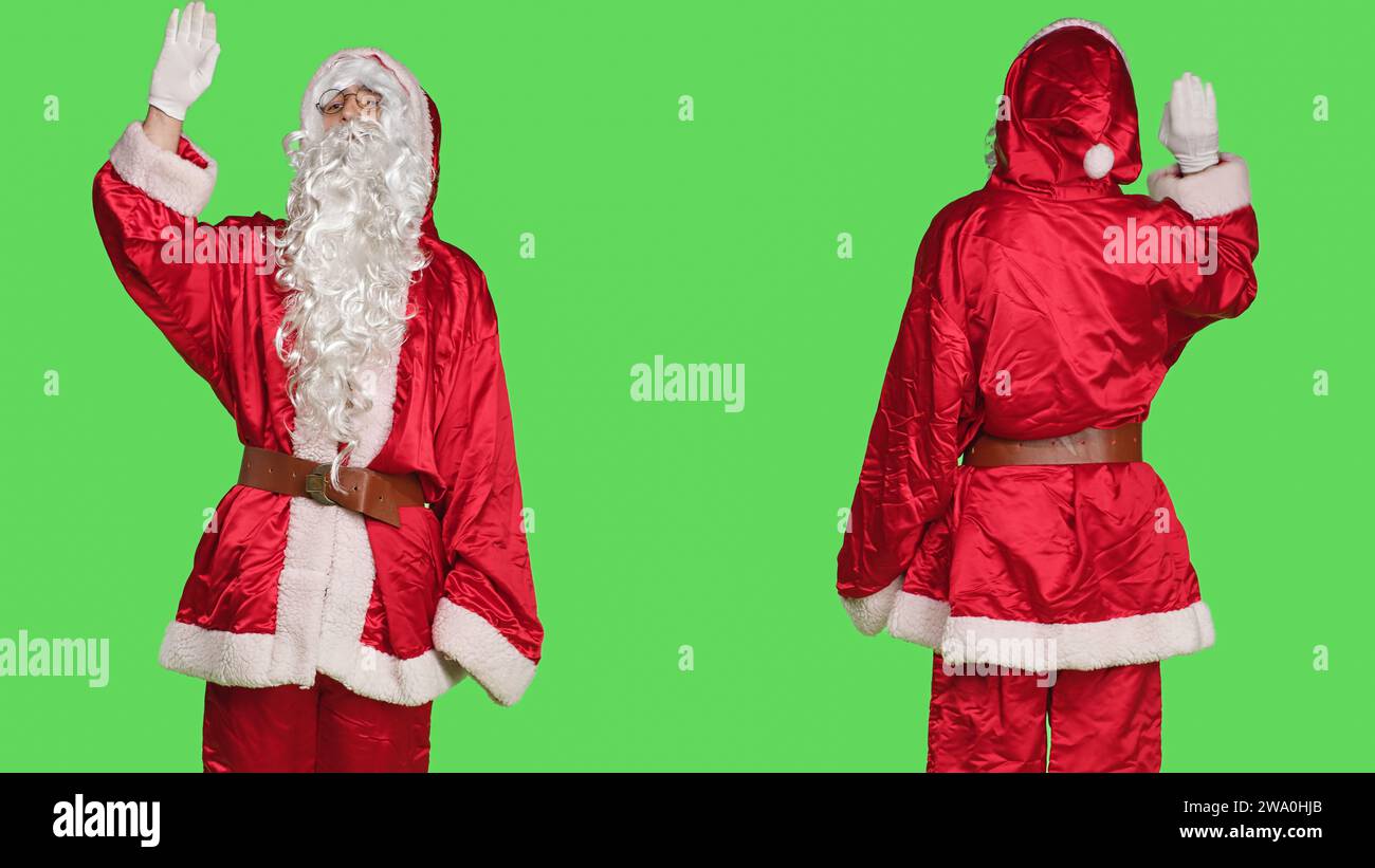 Saint nick enbodiment greeting people, wearing festive seasonal costume ...