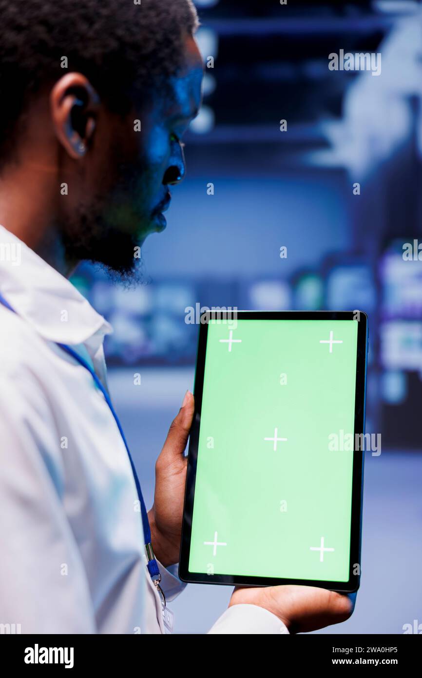 Specialist investigating performance trends in data center mainframes ...