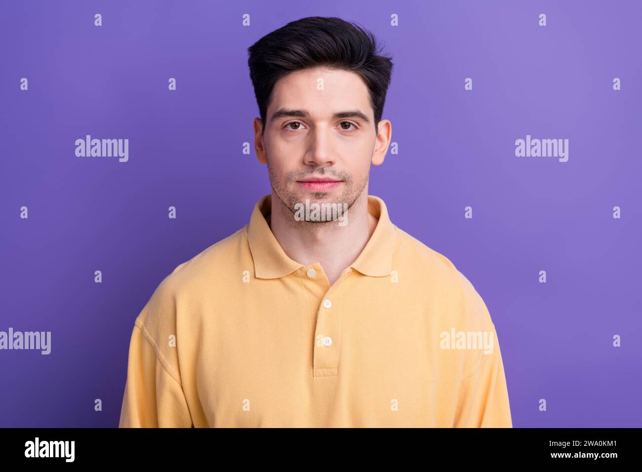 Photo of serious confident man dressed yellow shirt smiling isolated ...