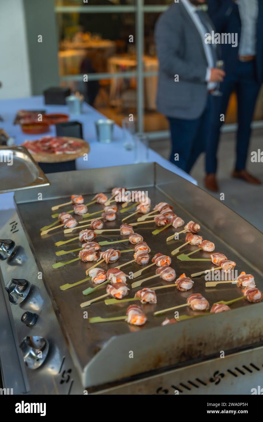 Canapes frying on a hot griddle at a wedding at lunch Stock Photo - Alamy